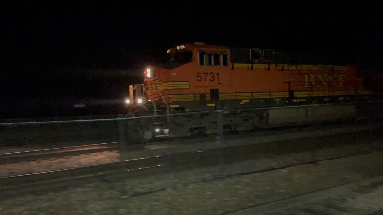 BNSF 5731 leads a westbound BNSF sand train at Big Lake, MN - YouTube