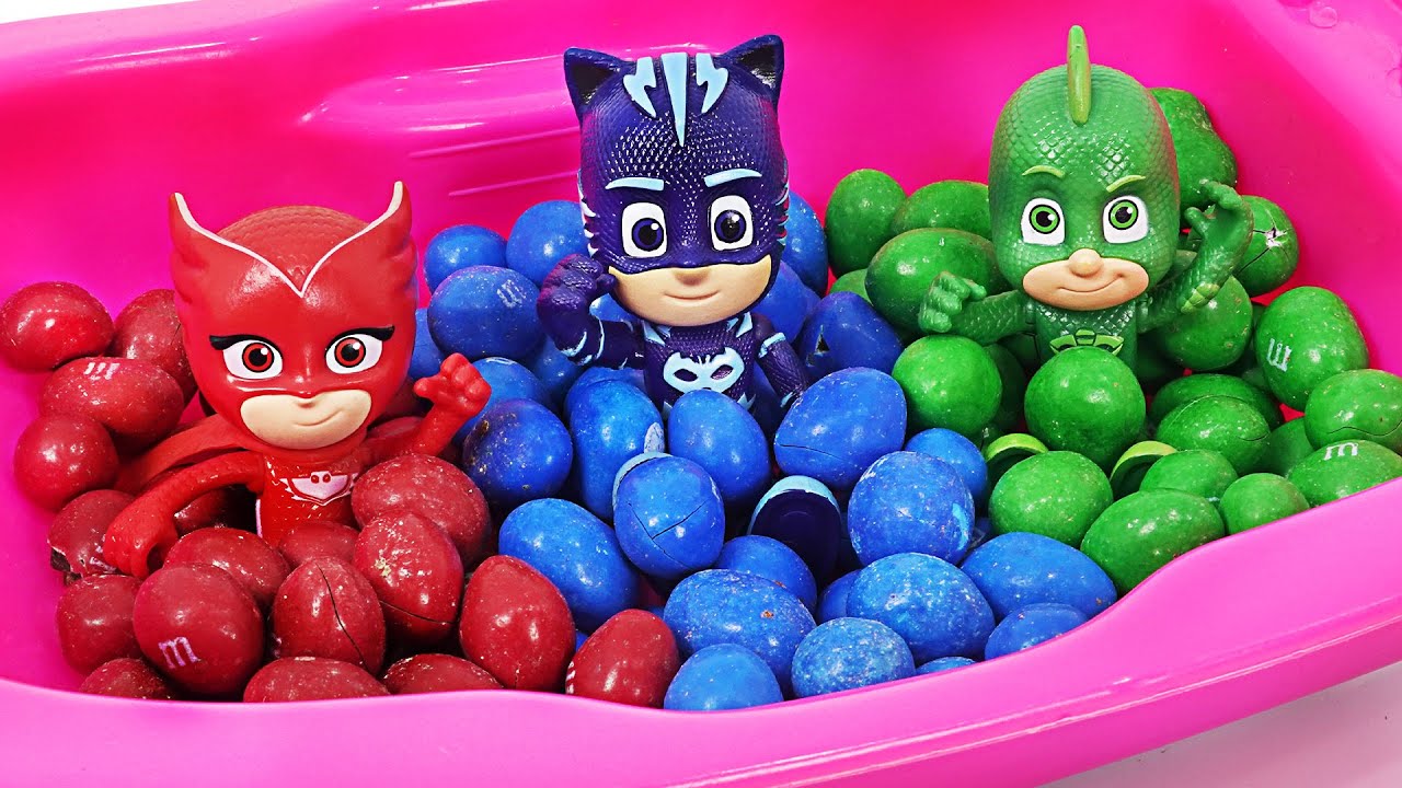 PJ Masks! I went into the pile of M&M chocolate and a huge egg appeared ...
