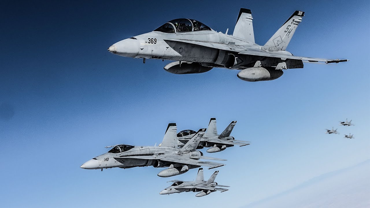 U.S. Marines conduct a mass formation launch known as “flying the barn ...