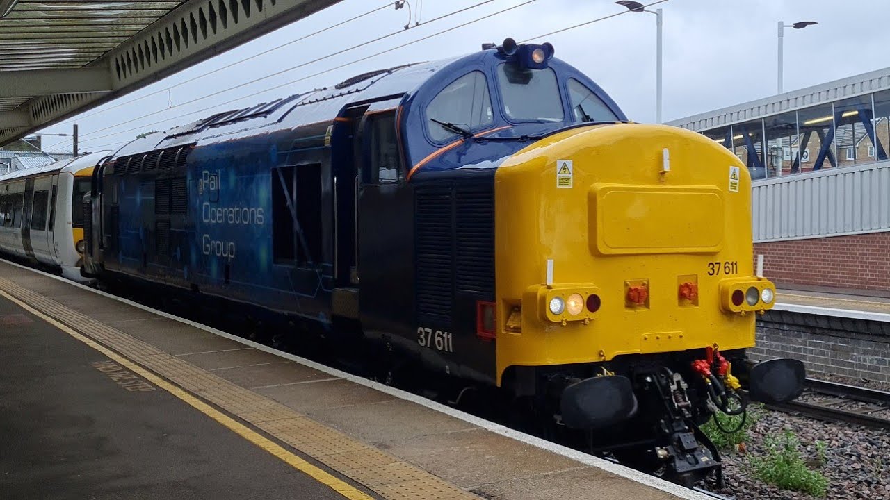 Rail Operations Group 37611 passing Peterborough with 379008 and 379022 ...