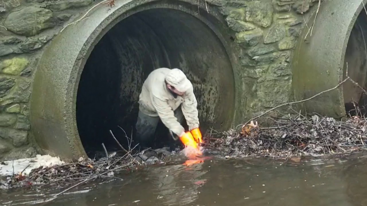 Unclogging Big Culvert - YouTube