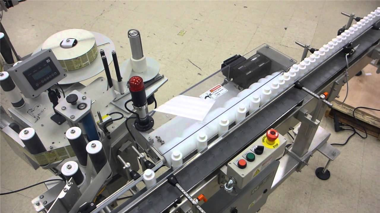 Wrap Labeling System LSI Model 1500 on Round Water Bottles - YouTube