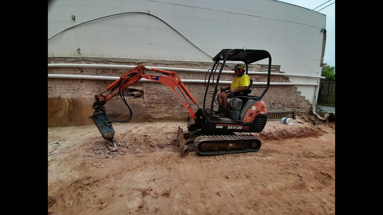 Mini Excavator Rock Breaking cutting hard rock & removal - YouTube