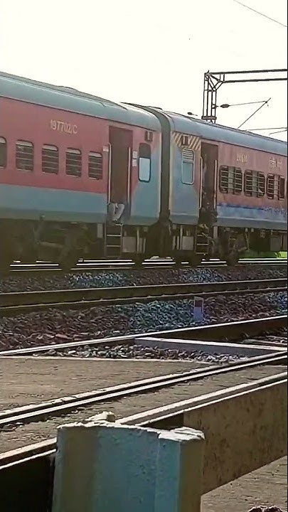 WAG 9 Hauled NEW TINSUKIA Weekly Superfast Express Approaching LC Gate with Stormy momentum ...