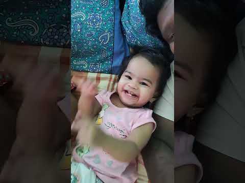 Baby Anika with her mom and dad sleeping on the bed