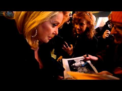 French Legend Catherine Deneuve promoting Potiche signing autographs in person. E1autographs