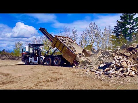 "Chain System" Roll Off Truck Moving Drop Boxes And Dumping Concrete ...