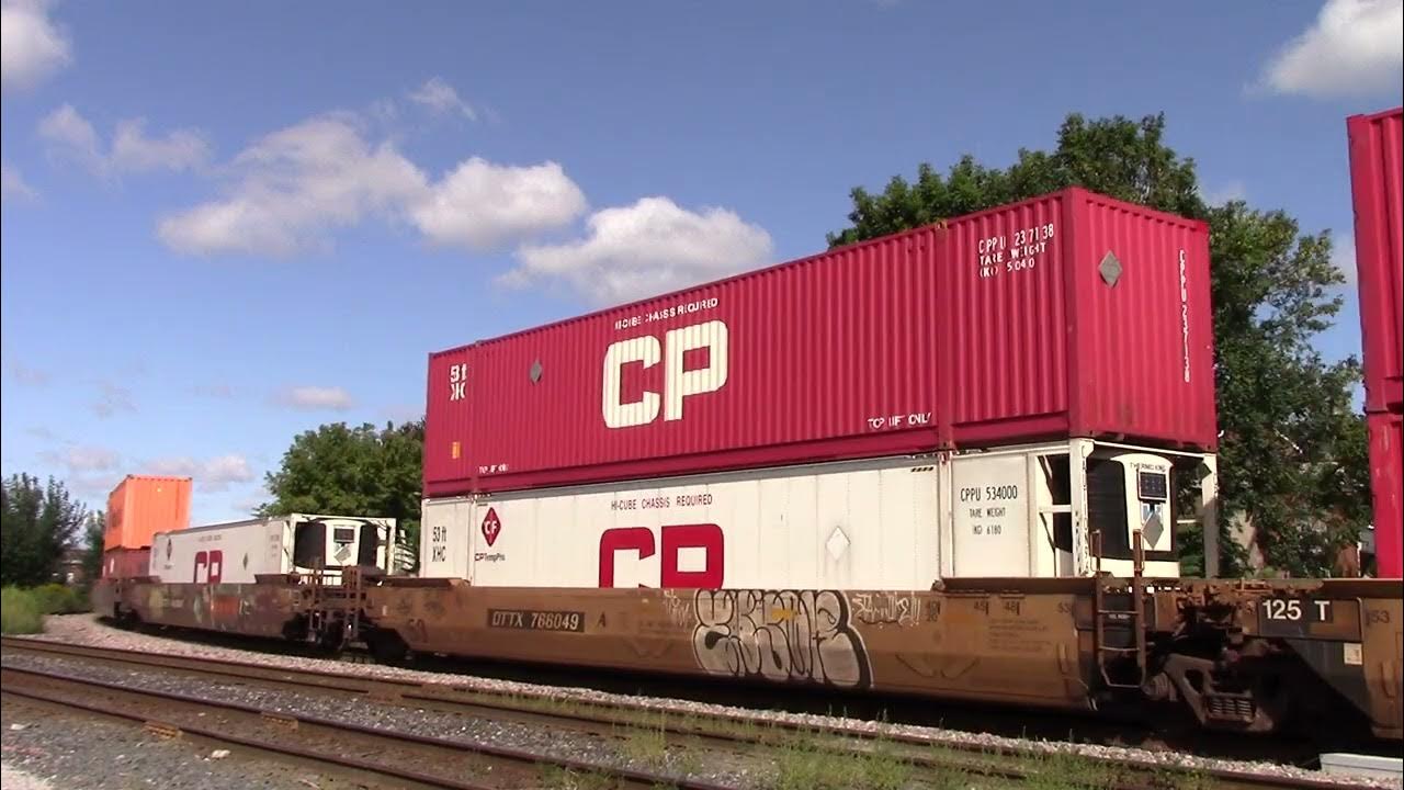 (CPKC) CP 118 with KCS 4772 mid DPU passing Osler - YouTube