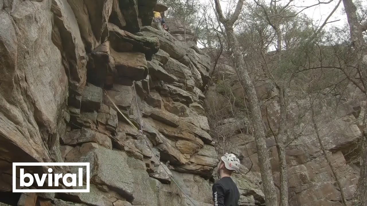 Climber, wearing a helmet, gets hit on the head with a rock. - YouTube