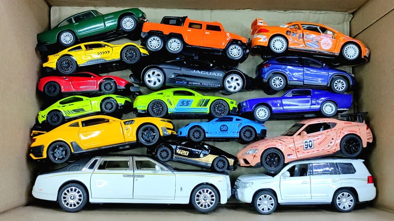 Box full of various miniature cars Peugeot, Volvo, Renault, Hyundai ...