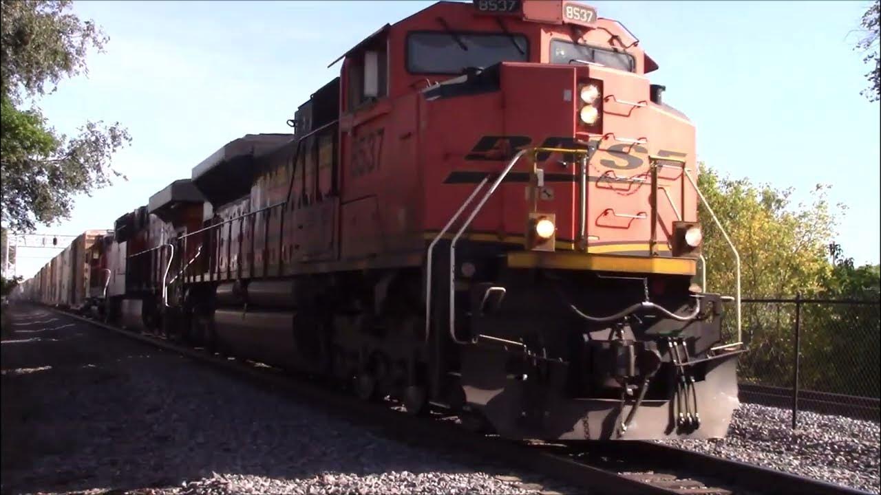 BNSF 8537, BNSF 7149, and BNSF 2546 lead a westbound manifest through Anoka, MN - YouTube