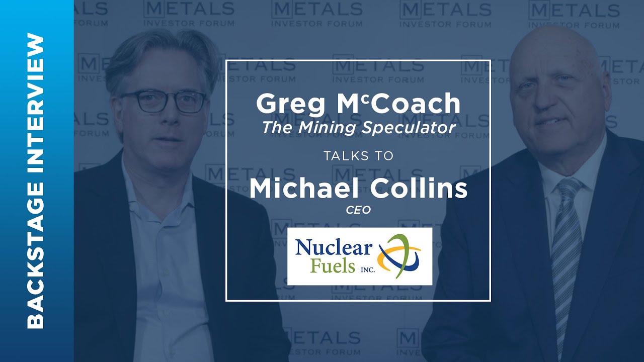 Michael Collins of Nuclear Fuels Inc. talks to Greg McCoach at the May ...