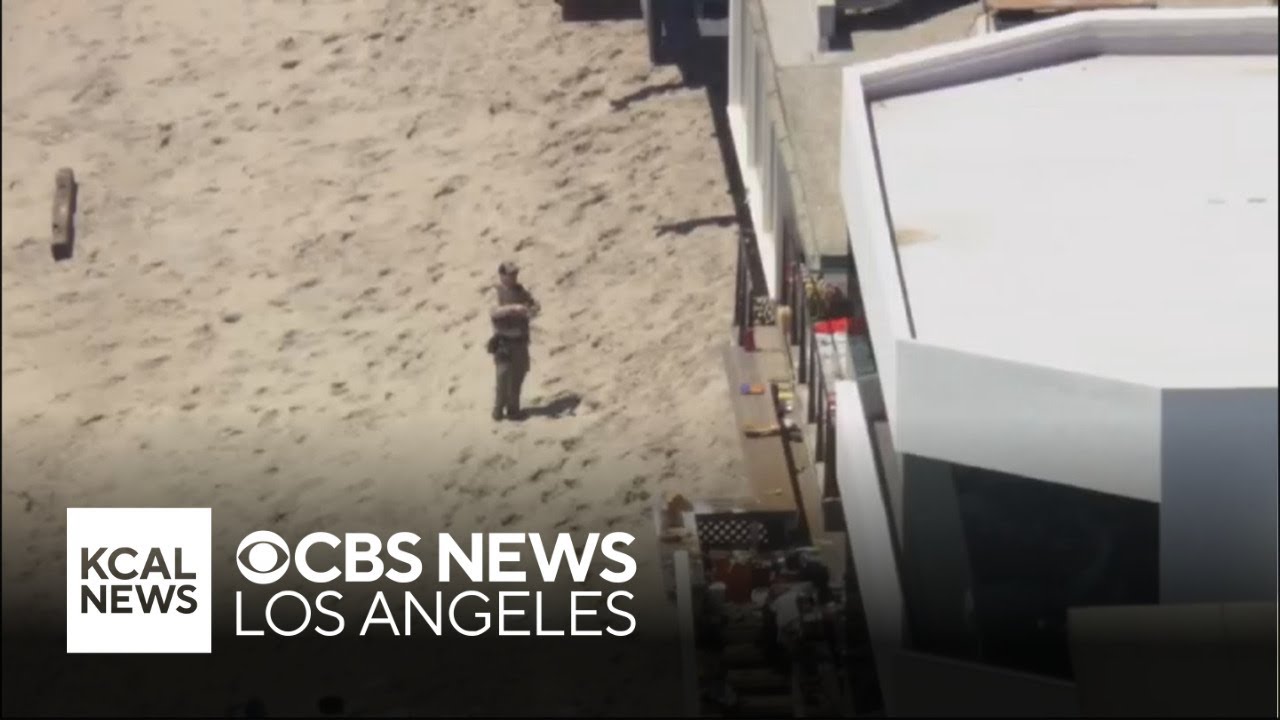 Woman barricades inside beachfront home in Malibu - YouTube