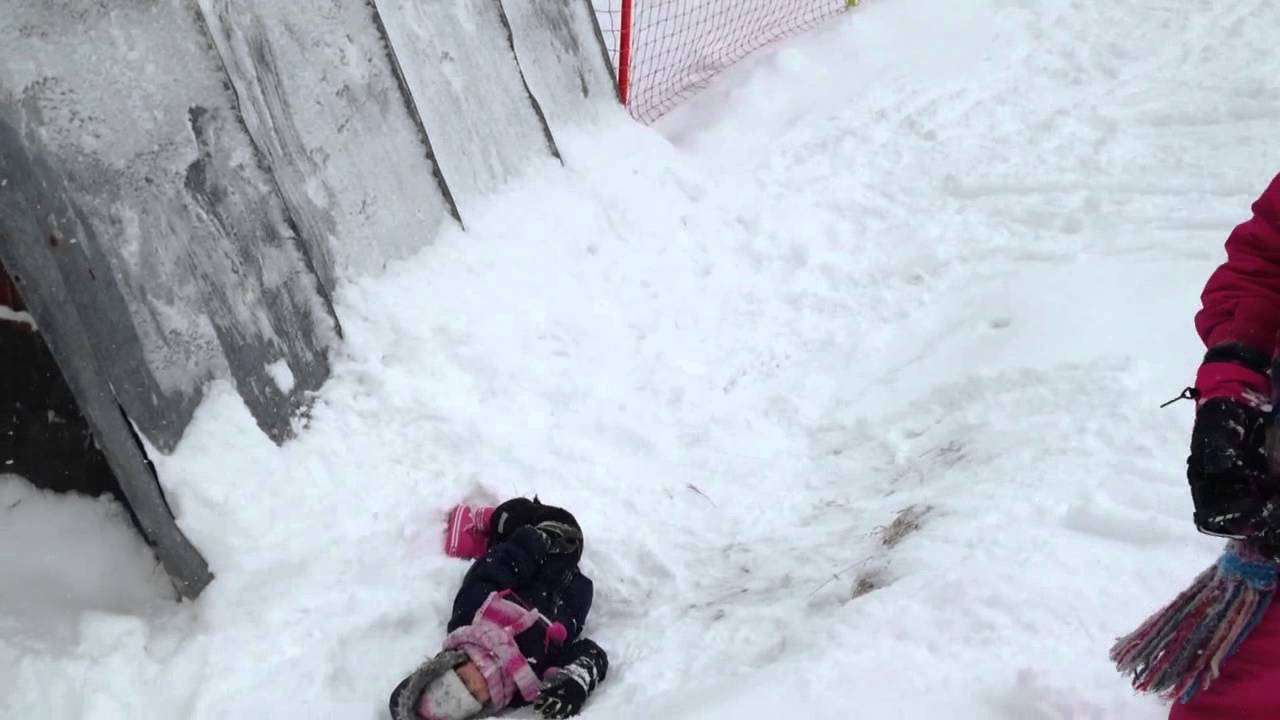 What a happy child does when stuck in the snow! - YouTube