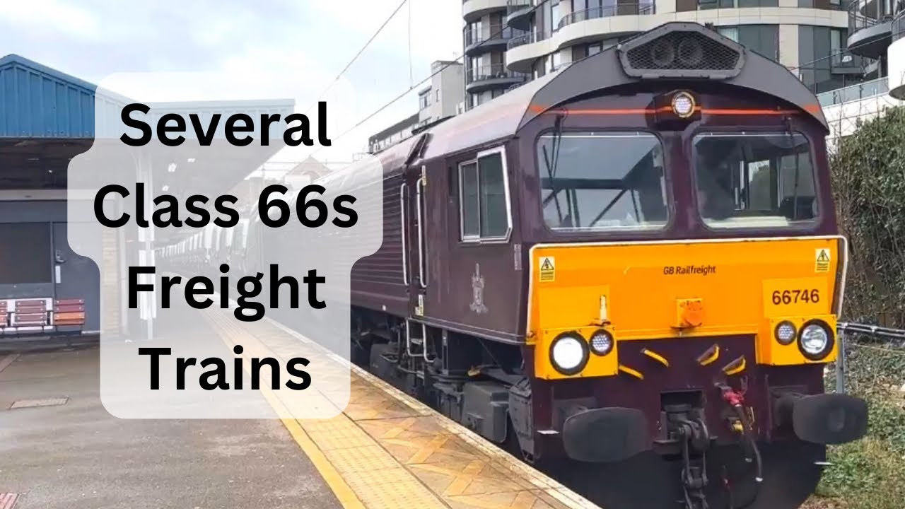 Several Class 66 freight trains are seen passing by Barking Station ...