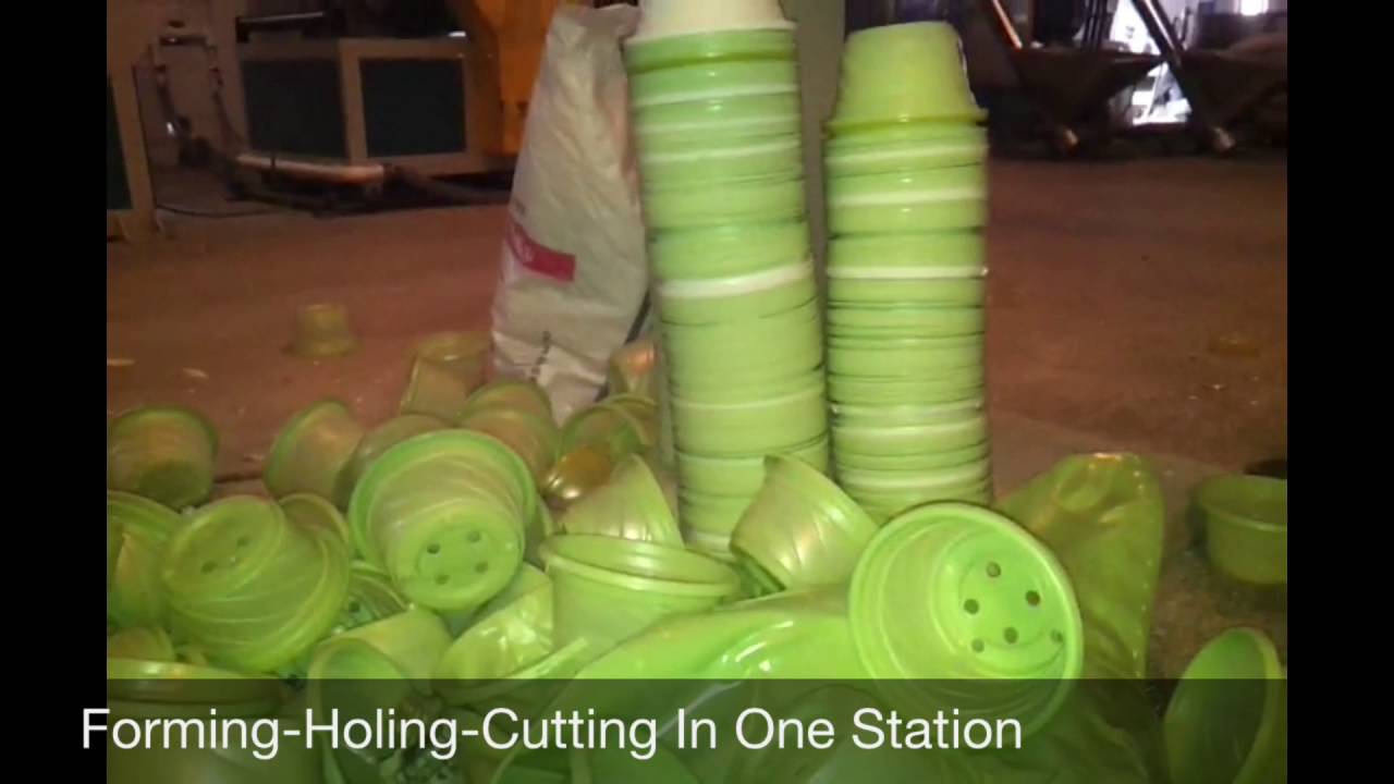 Flower pot machine, forming holing and cutting in one station - YouTube