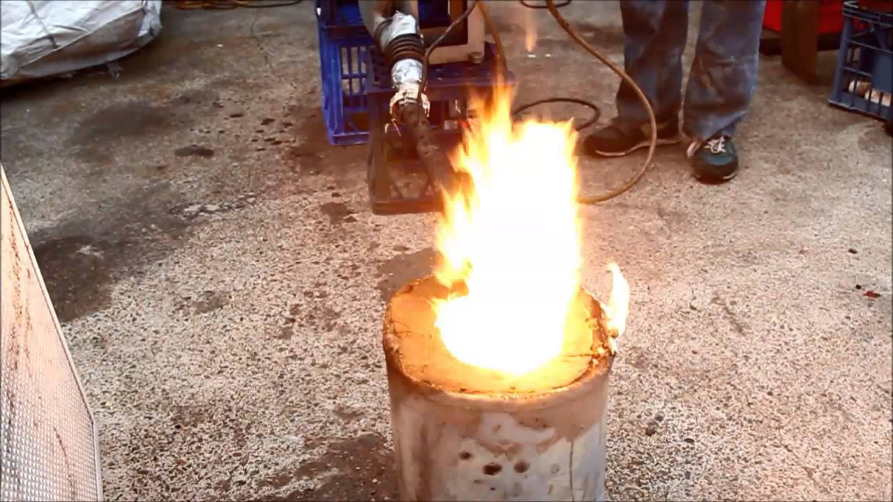 Melting soda cans and aluminium in furnace made from dirt Waste oil ...