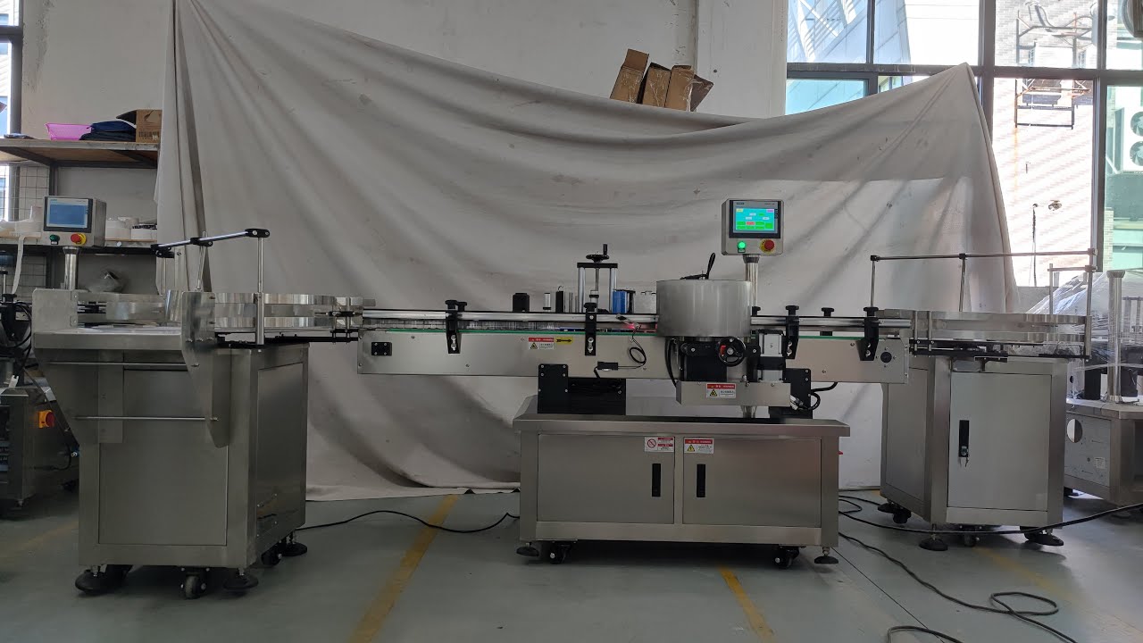 Automatic high speed round bottle labeling machine - YouTube
