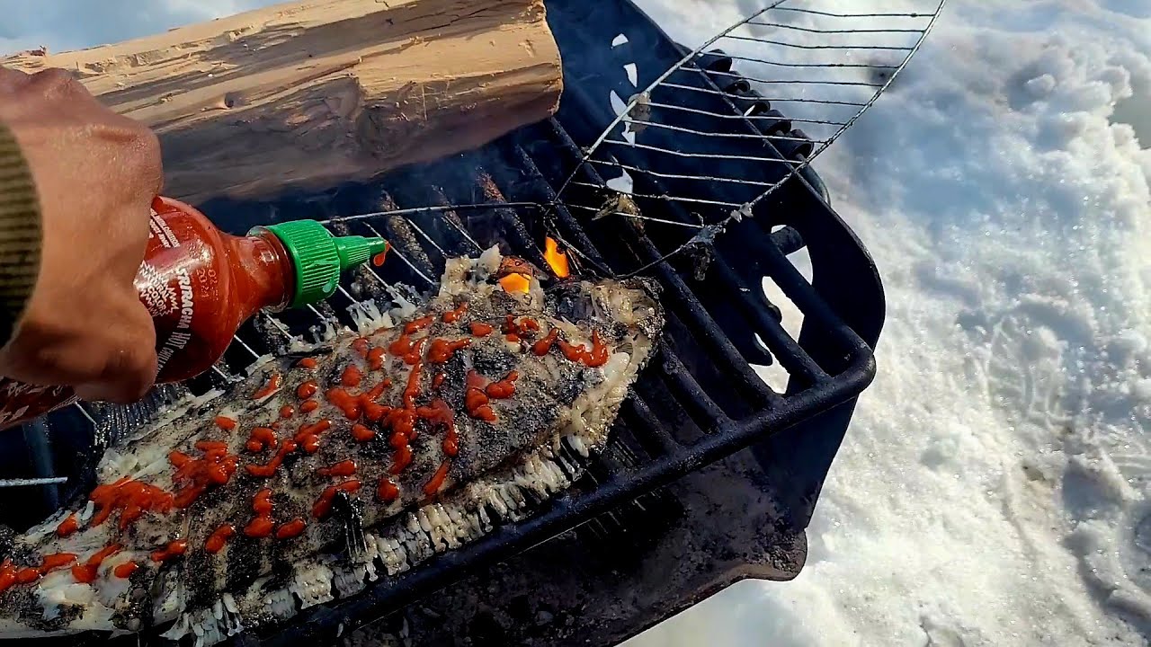Eating freshly grilled sole fish on a cold snowy winter day at Mt Baldy ...