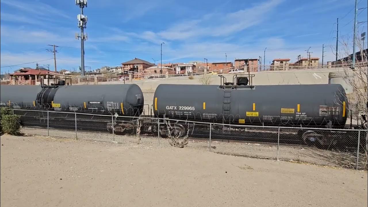 Union Pacific eastbound monster manifest train with a mid-train DPU in downtown El Paso TX 03/02 ...