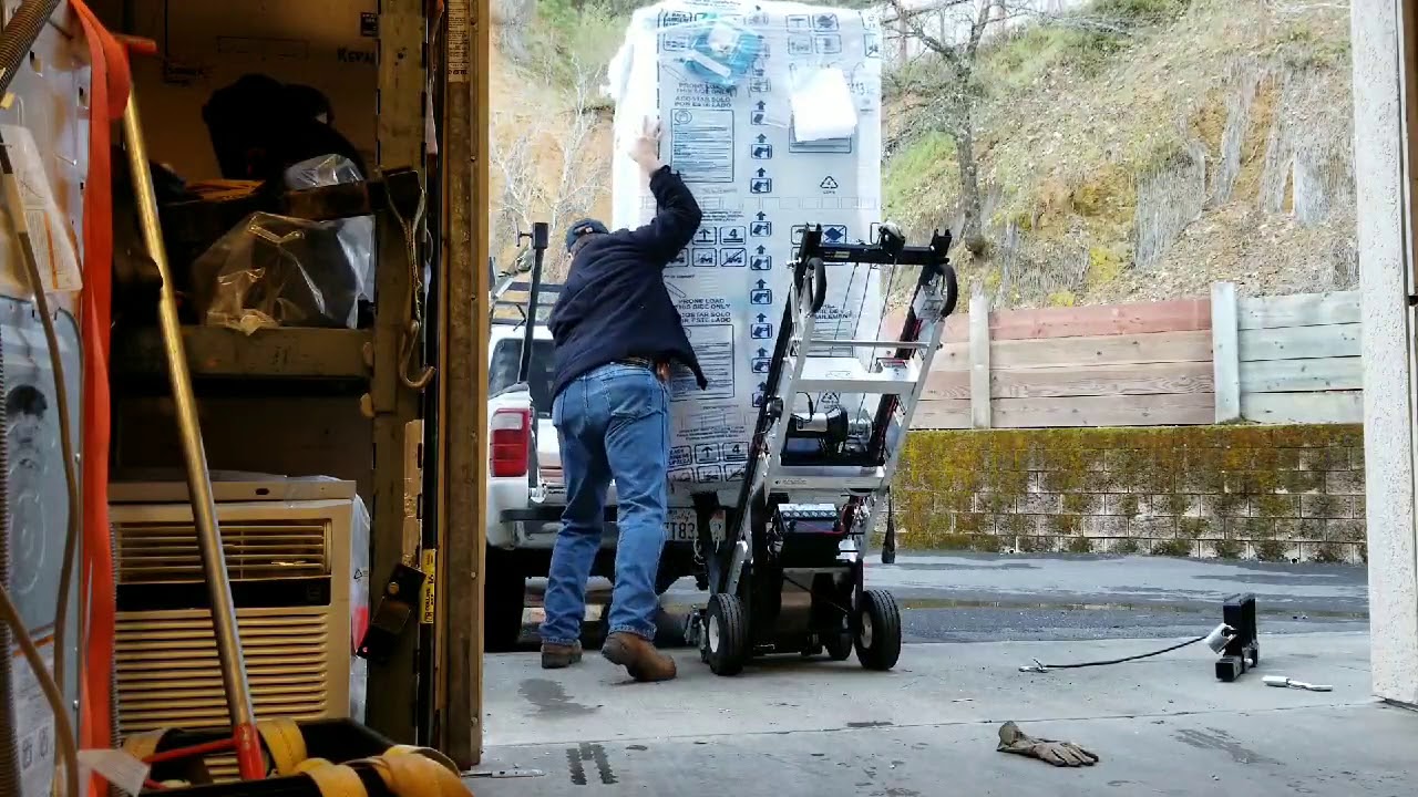 One man fridge load into truck: I can carry it up 100 or more steps ...