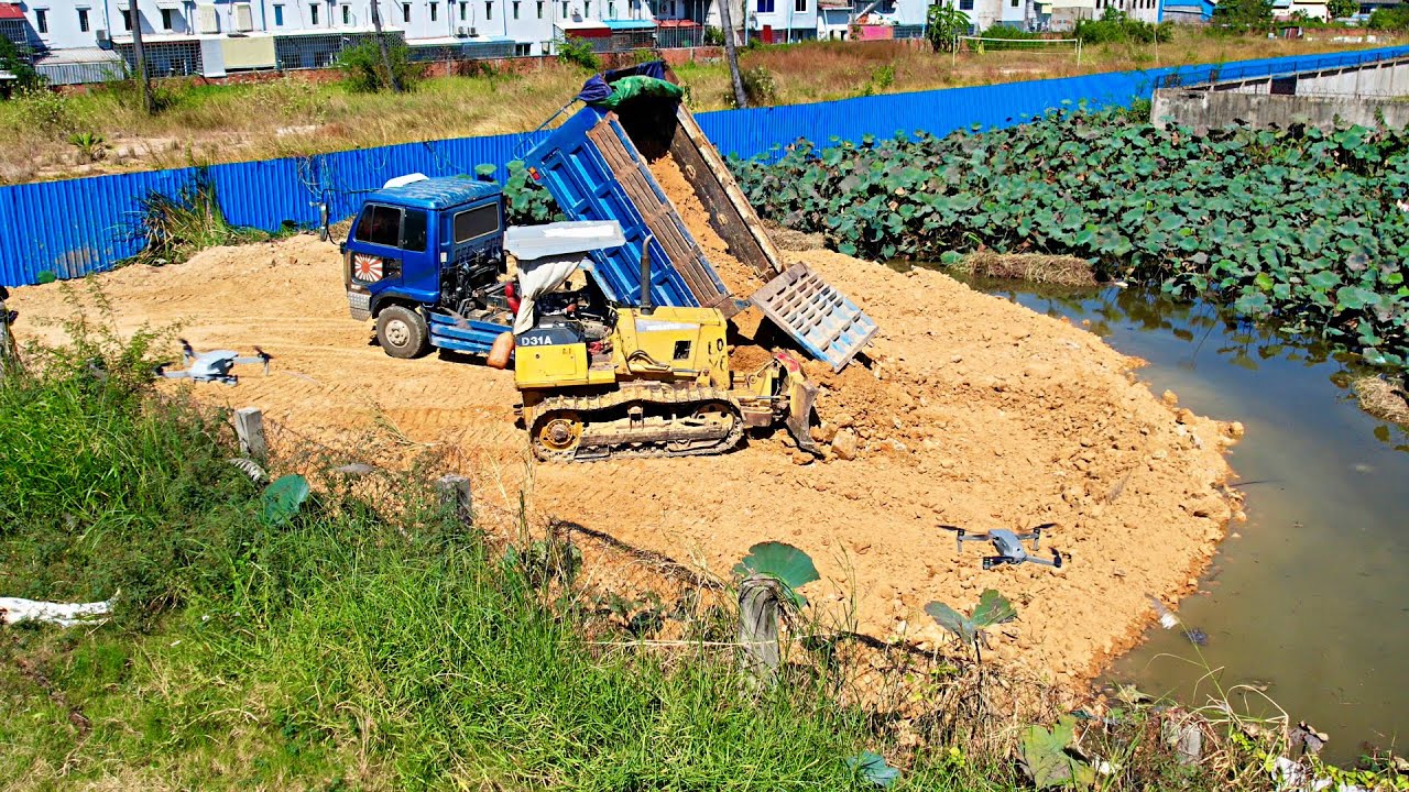 Action Project Bulldozer Working Stone Removal with mini Dump Trucks ...