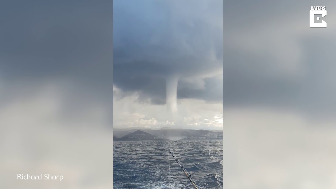 Waterspout Stuns Fishermen - YouTube