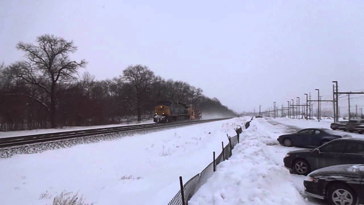 RARE! CSX AC4400-CW #352 leads a snow plow unit through Ogden Dunes IN ...