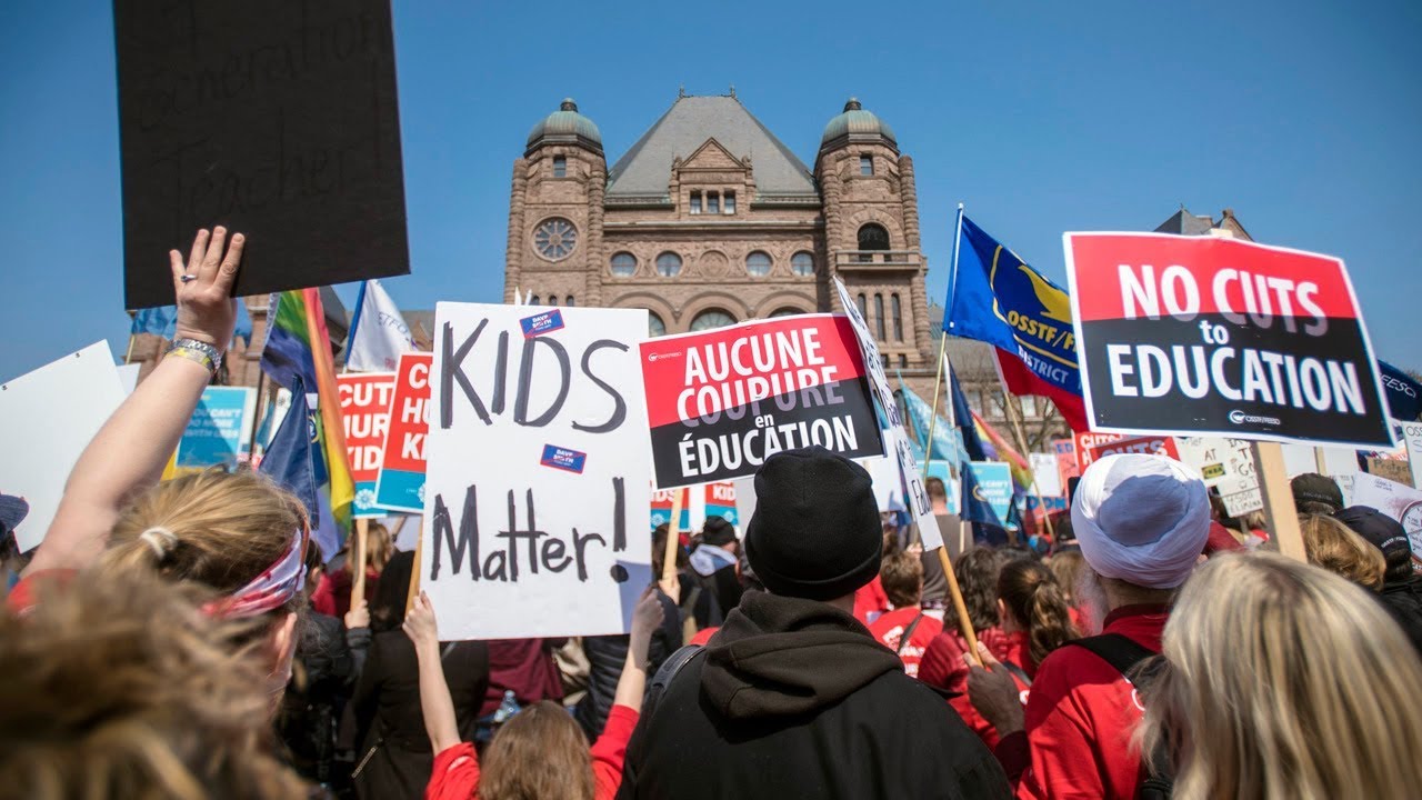 Thousands protest Ontario education cuts - YouTube