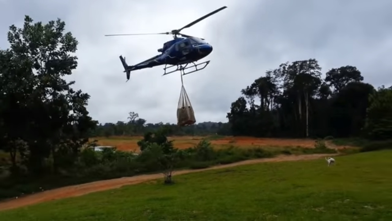Woman driving helicopter...BOOM! dropping cargo in the jungle - YouTube