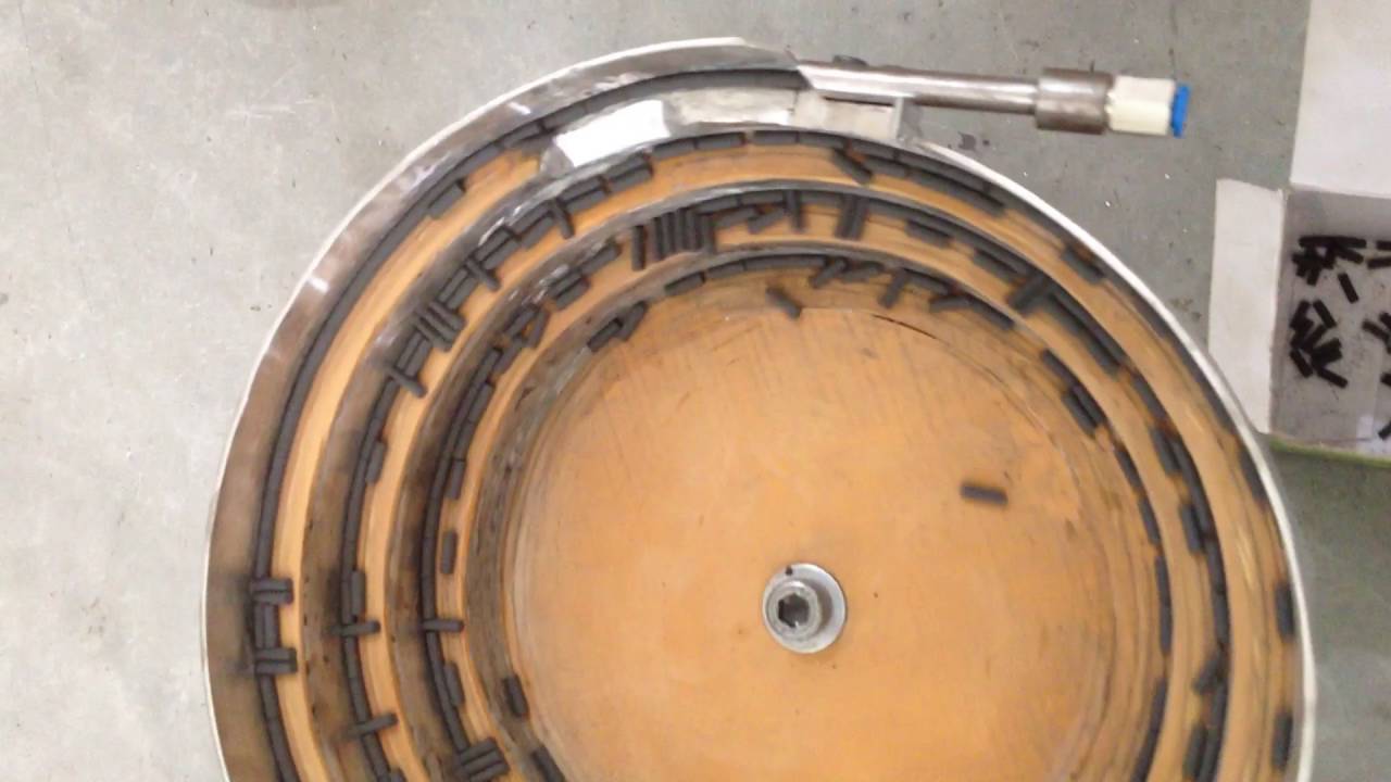 Vibratory bowl feeder for round rods - YouTube