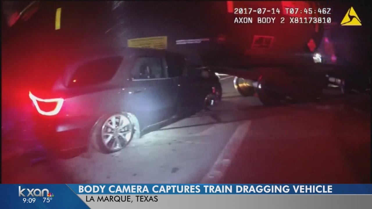 Body cam captures footage of train moving with SUV partially underneath ...