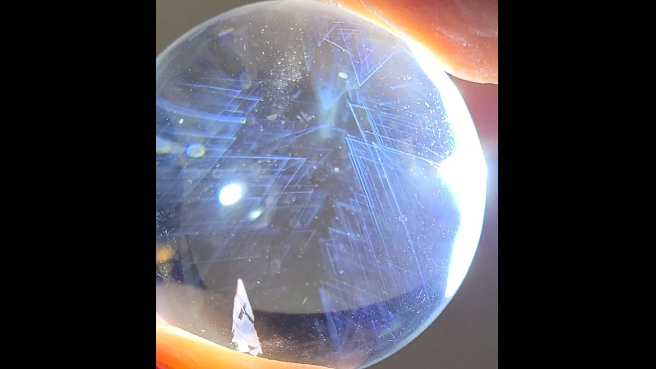 Blue angel feathers in quartz sphere with the blue needles forming V ...