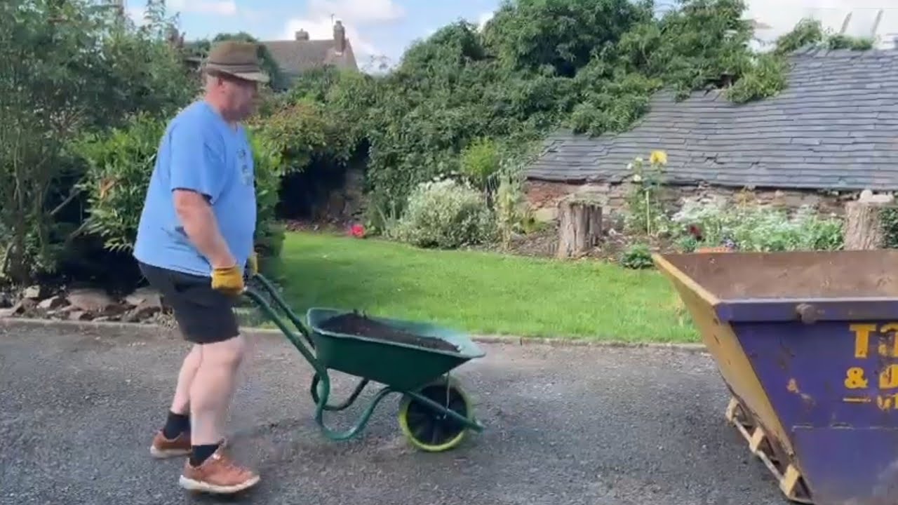How to empty a wheelbarrow into a skip on your own. - YouTube