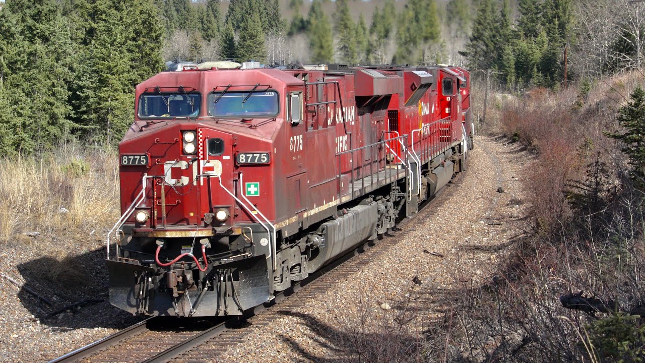 CP SD70ACu and Odd Train!!! CP 8775, CP 7006, and CP 8776 lead CP201 west near Ghost Lake ...