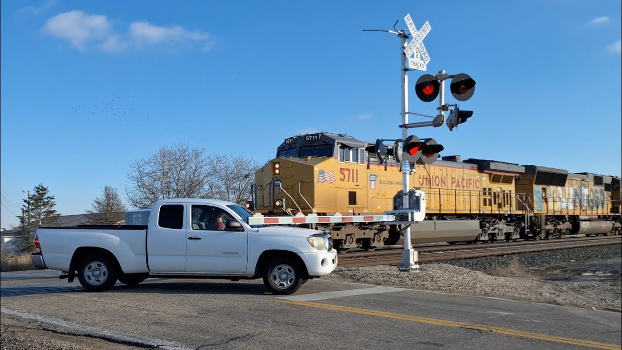 CLOSE CALL! Pickup nearly hit by fast westbound UP intermodal train ...