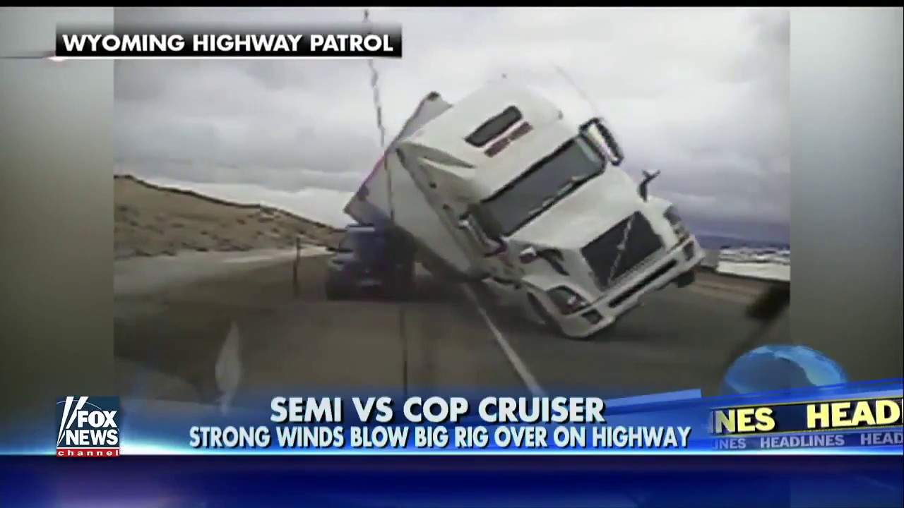 High Winds Tip Semi Truck Directly Onto A Cop Cruiser On A Wyoming ...