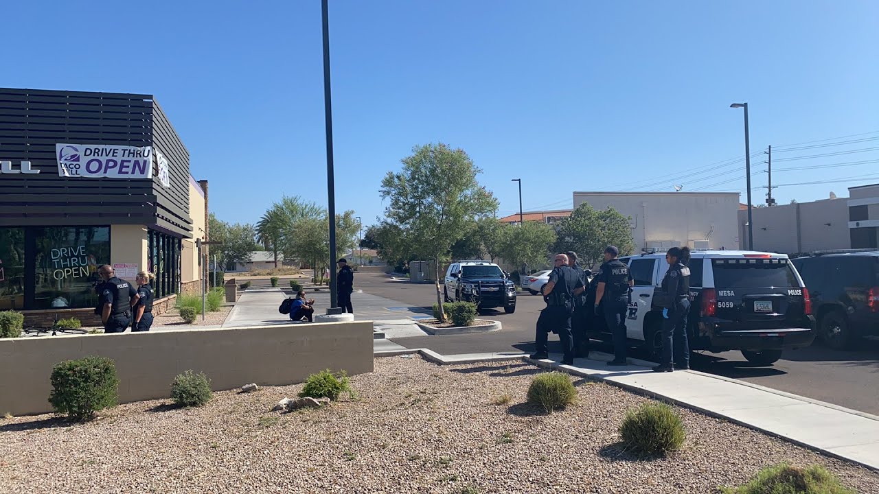Massive police presence at Taco Bell on power and main - YouTube
