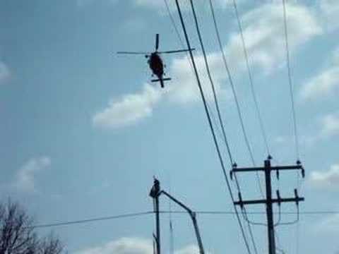 USCG Helicopter rescueing a stranded PECO worker - YouTube