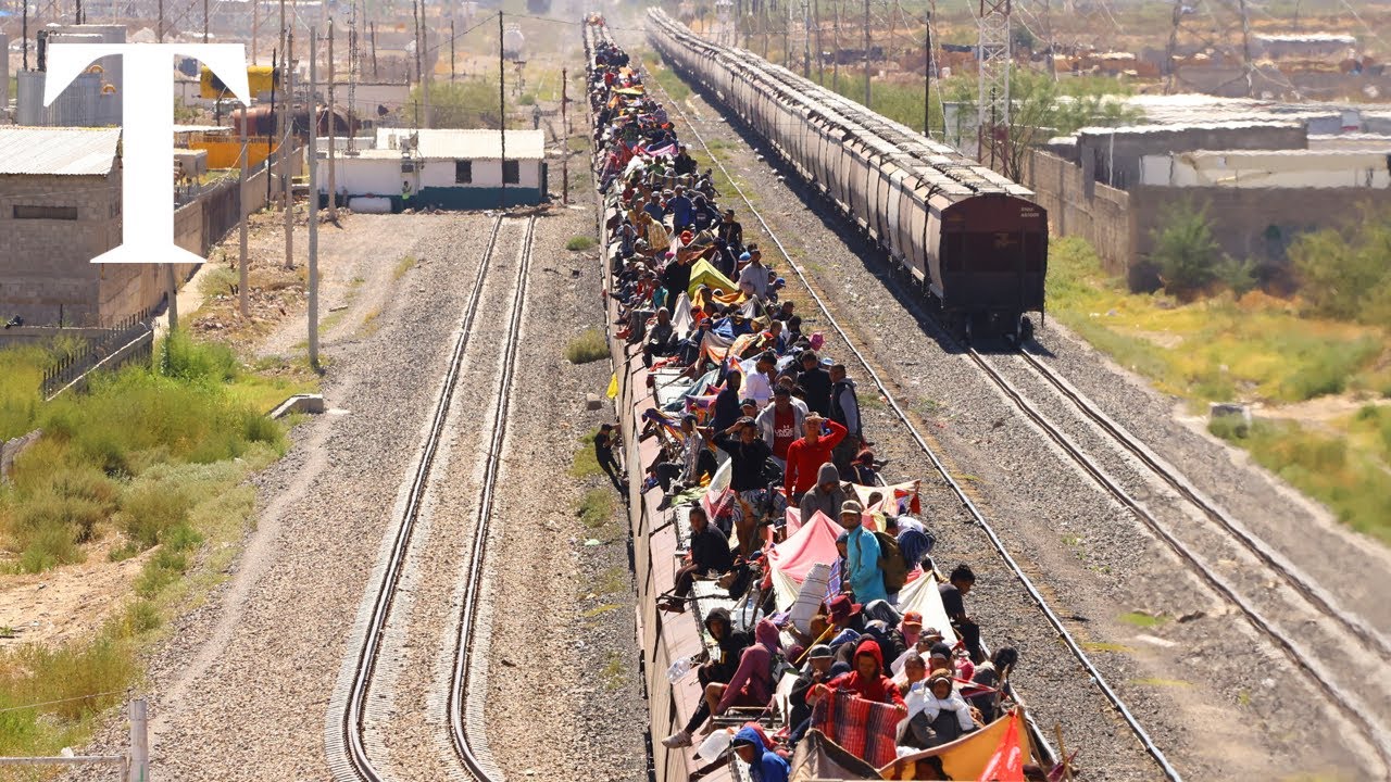 Migrants risk lives on freight train to claim asylum at US border - YouTube