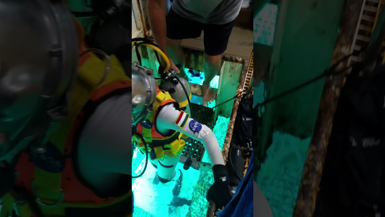 Exiting the Aquarius habitat to conduct the first EVA during NEEMO 23 ...