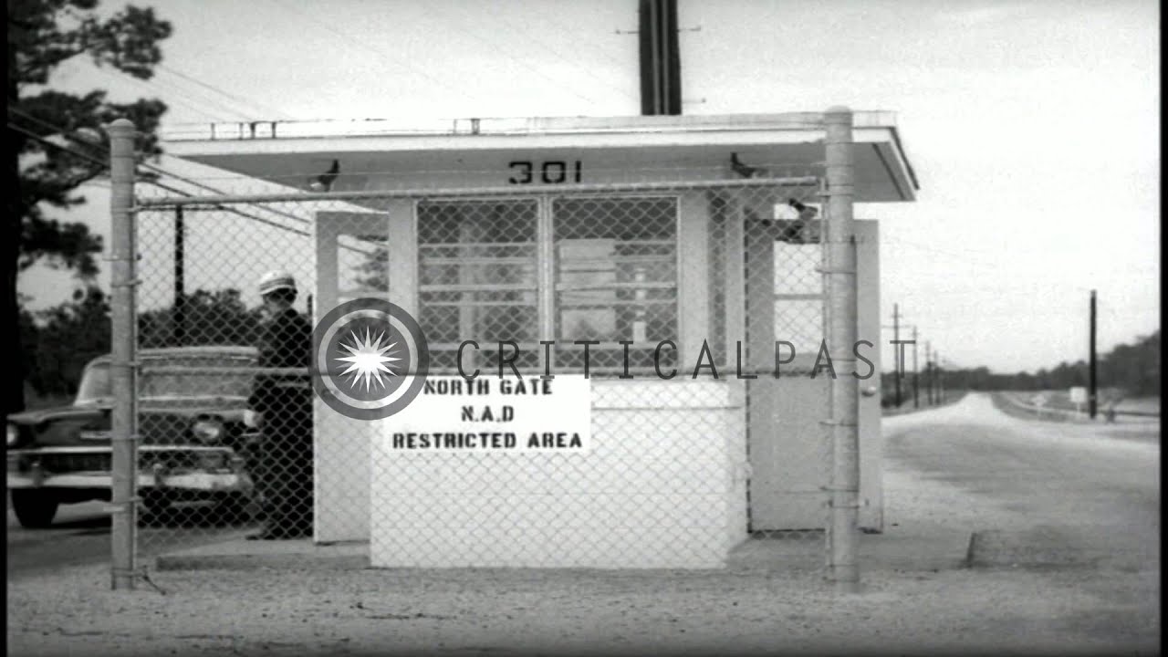 Marine sentries tending gate and Navy vehicle comes into gate in ...