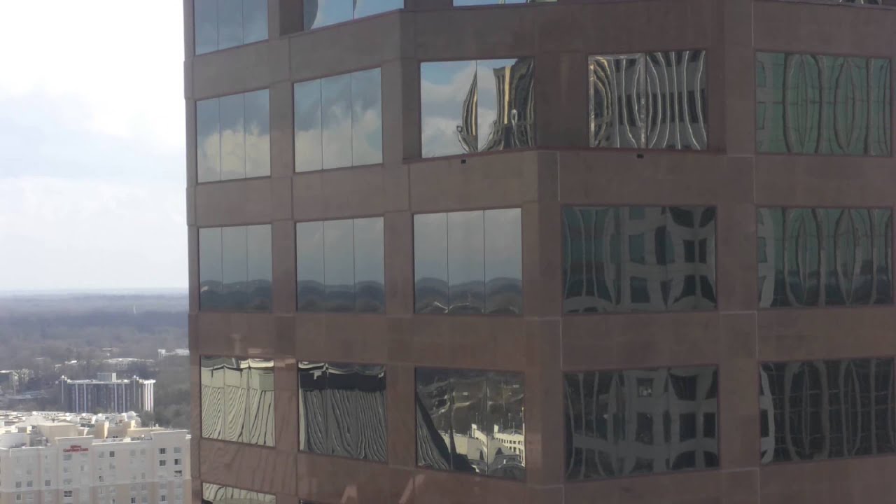 Skyscraper windows warp and shake in strong gusty winds - YouTube