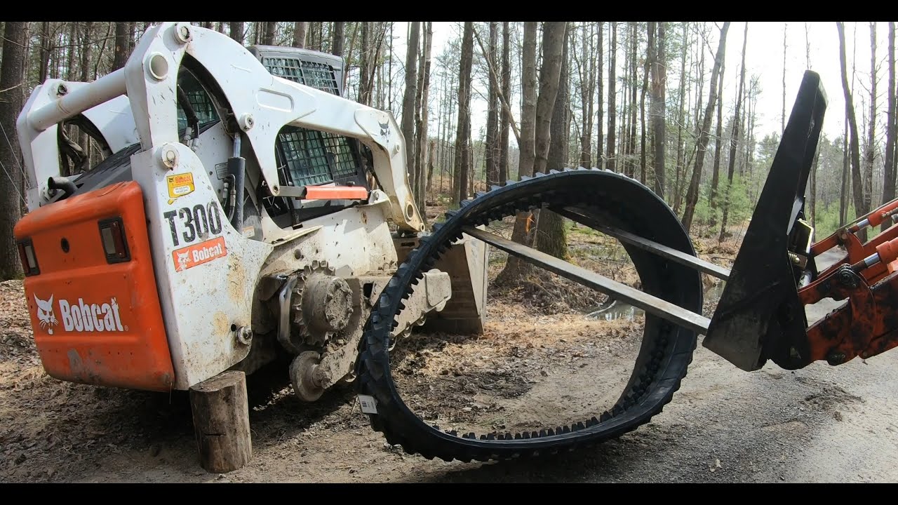 New skidsteer tracks and stump bucket - YouTube