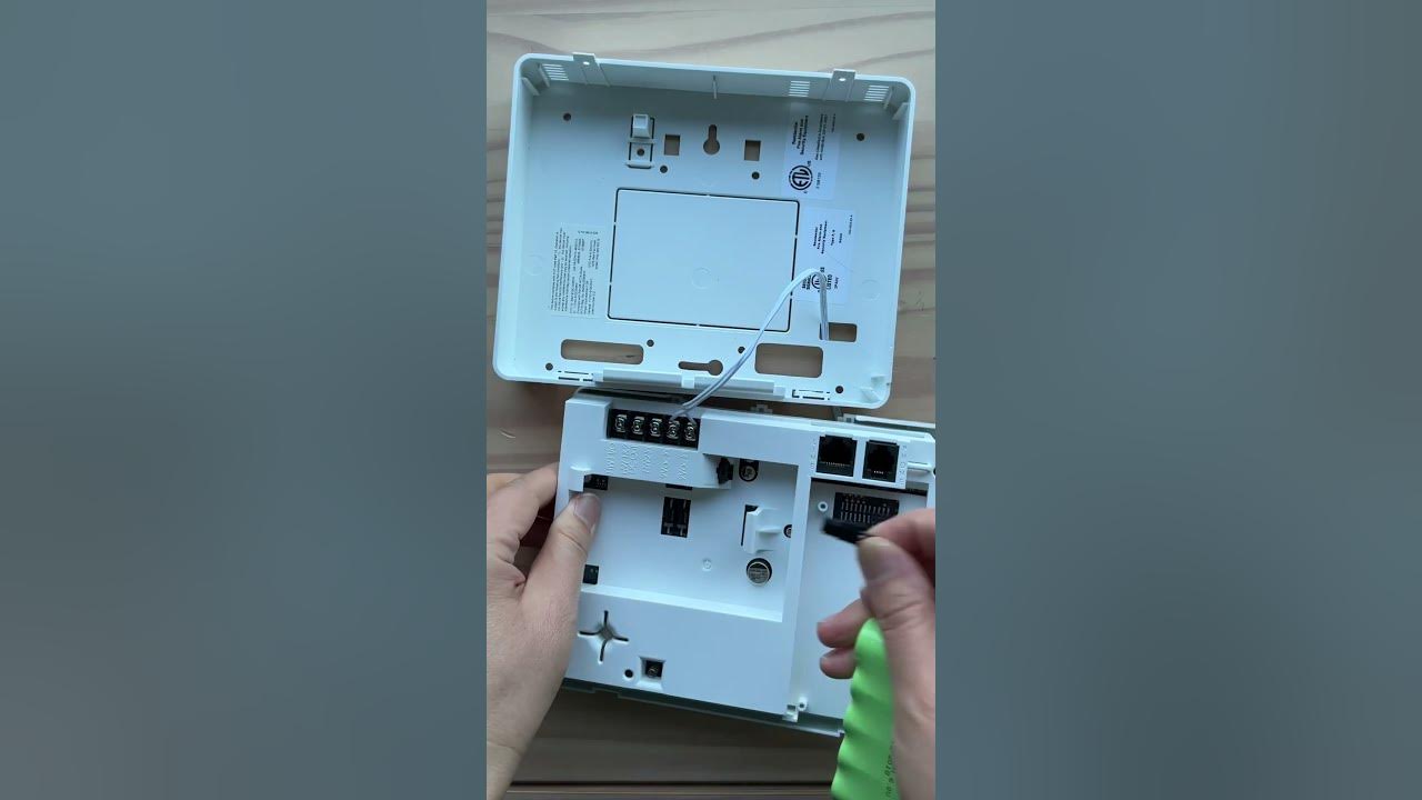 GE SIMON XTI install the battery - YouTube