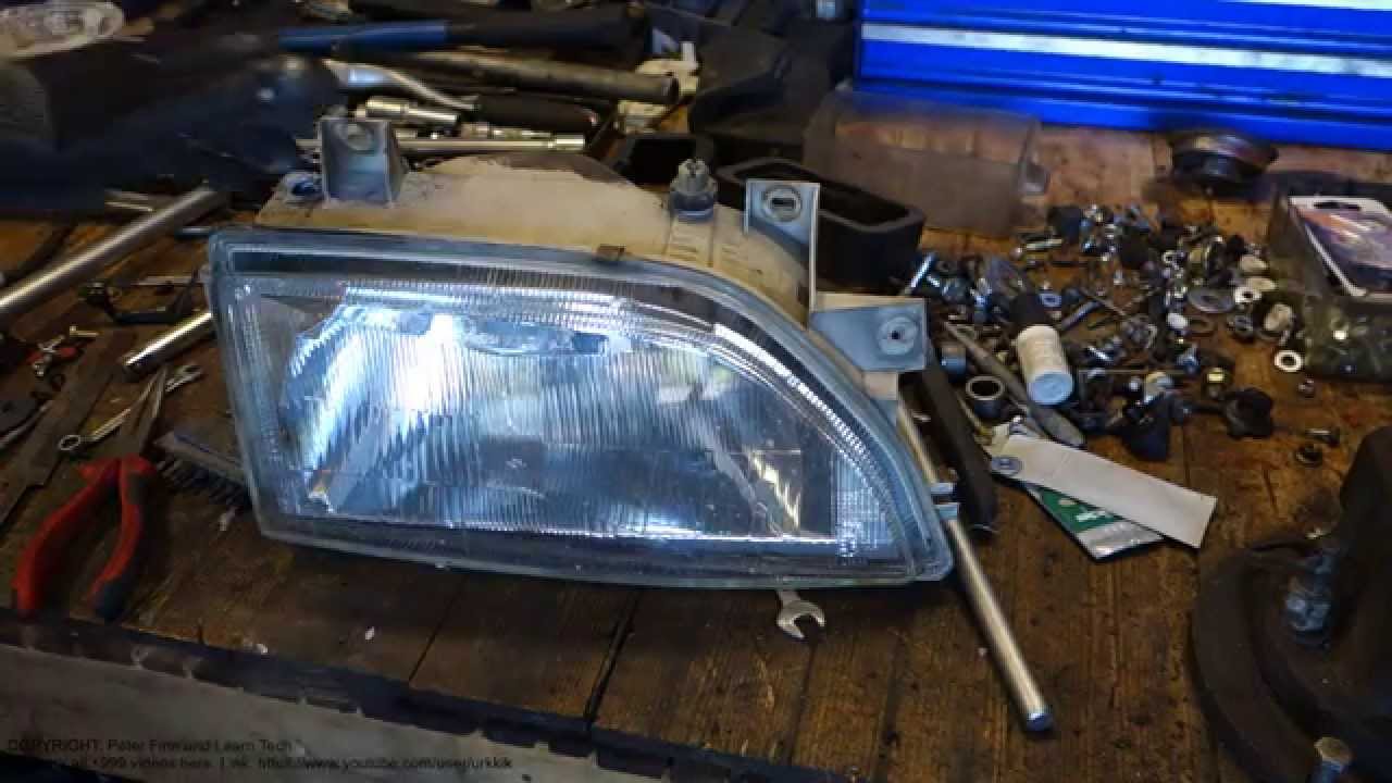 How works headlight beam up and down lift system in car or truck - YouTube