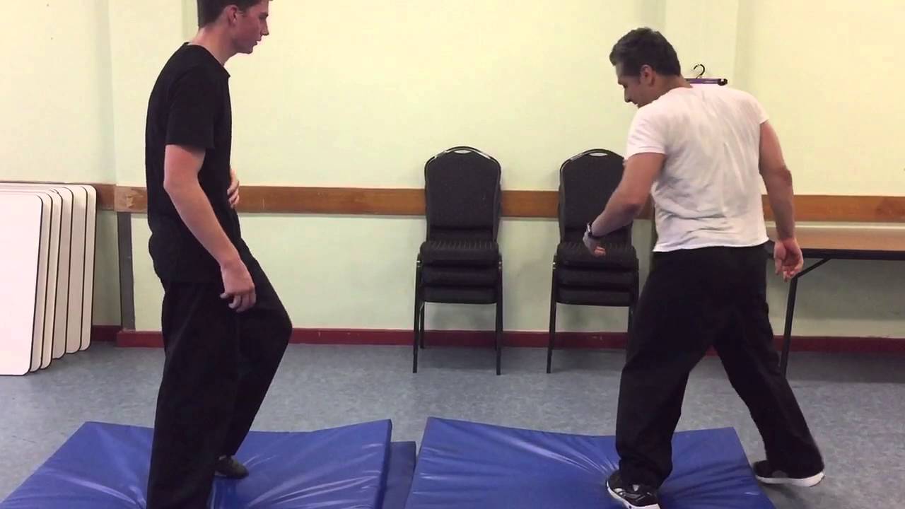 Blocking punches and applying wrist locks - YouTube