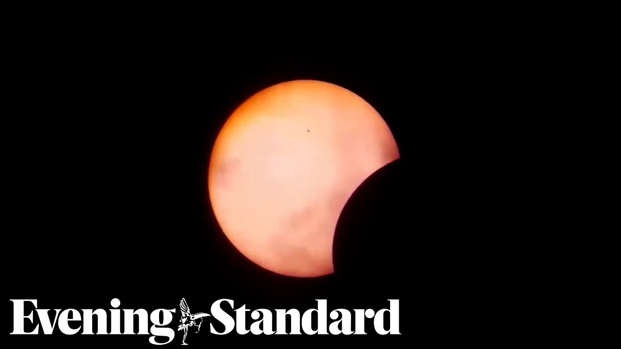 Watch rare eclipse over Australia and Asia - YouTube