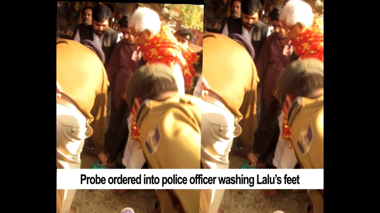 Probe ordered into police officer washing Lalu's feet - YouTube