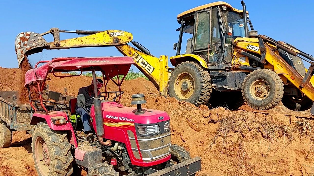 JCB 3DX Backhoe Loading Red Mud In Mahindra 575 Di And Newholland 4010 ...